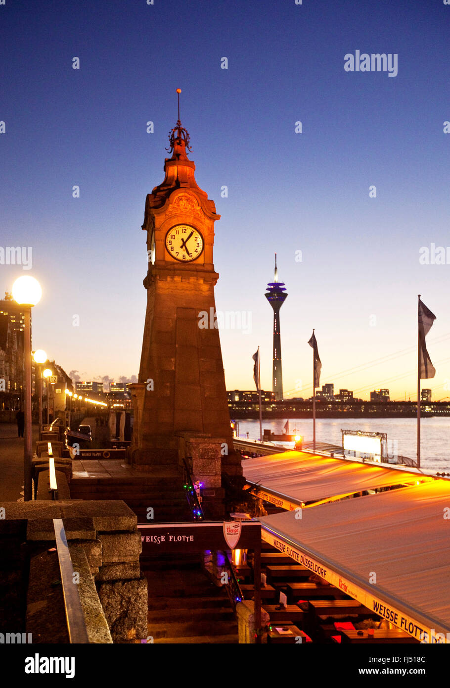 Rhine river promenade with gauge tower and Rheinturm, Germany, North ...