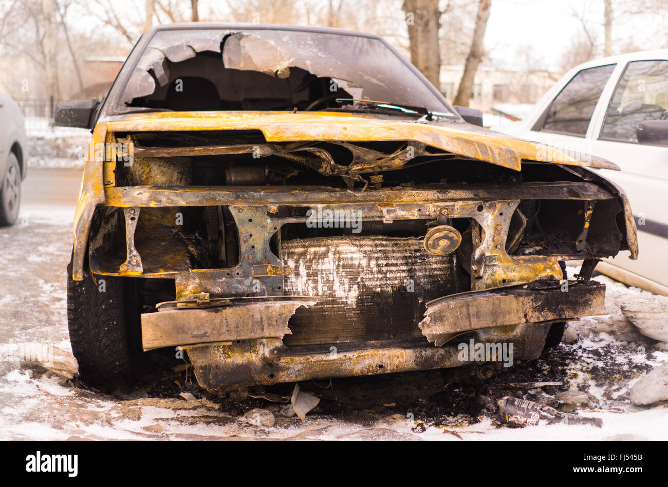 Burned car parked on the street, closeup Stock Photo - Alamy