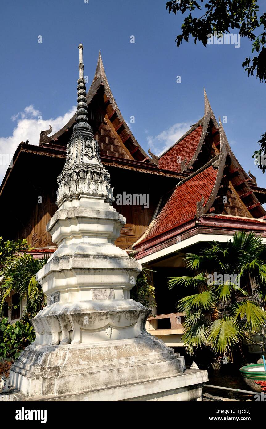 Ayutthaya, Thailand: White Chedi stands outside teak wood monastic ...