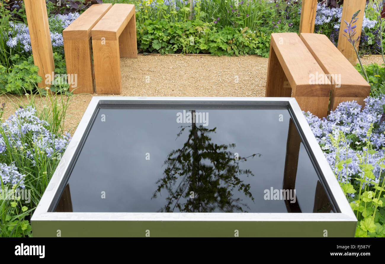 small garden pond water feature with wood wooden bench benches seat ...