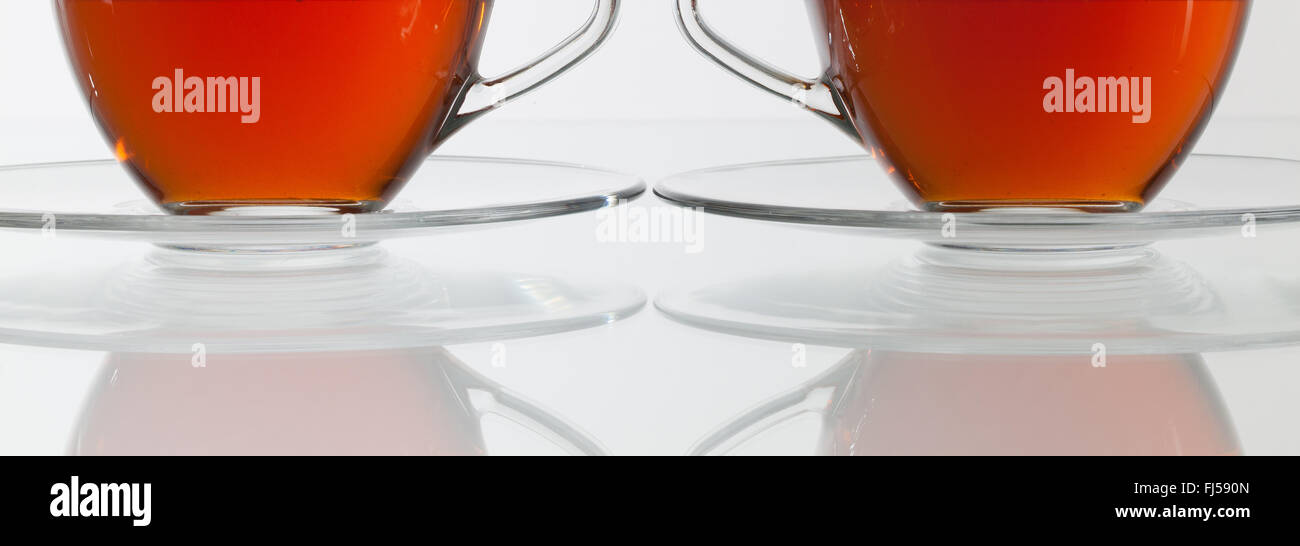 Two cups of tea on the glass table Stock Photo - Alamy