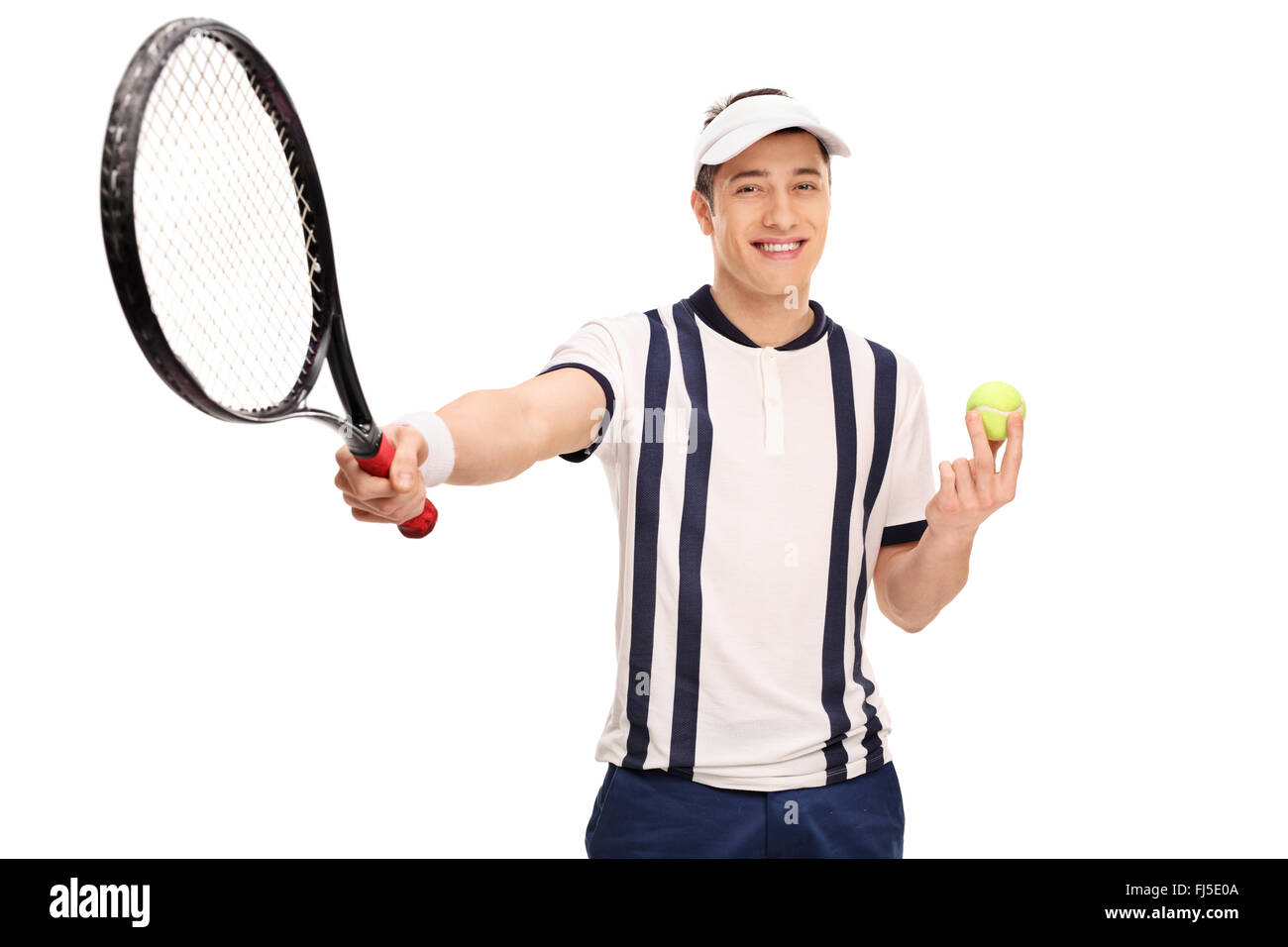 Young tennis player holding a racket and a ball isolated on white ...