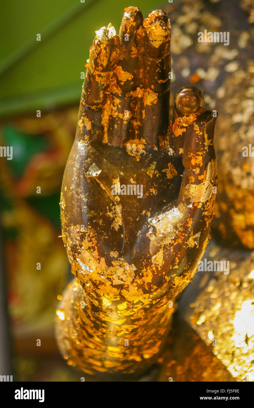 Hand of golden statue of Budha in the Budhist Temple in Thailand Stock ...