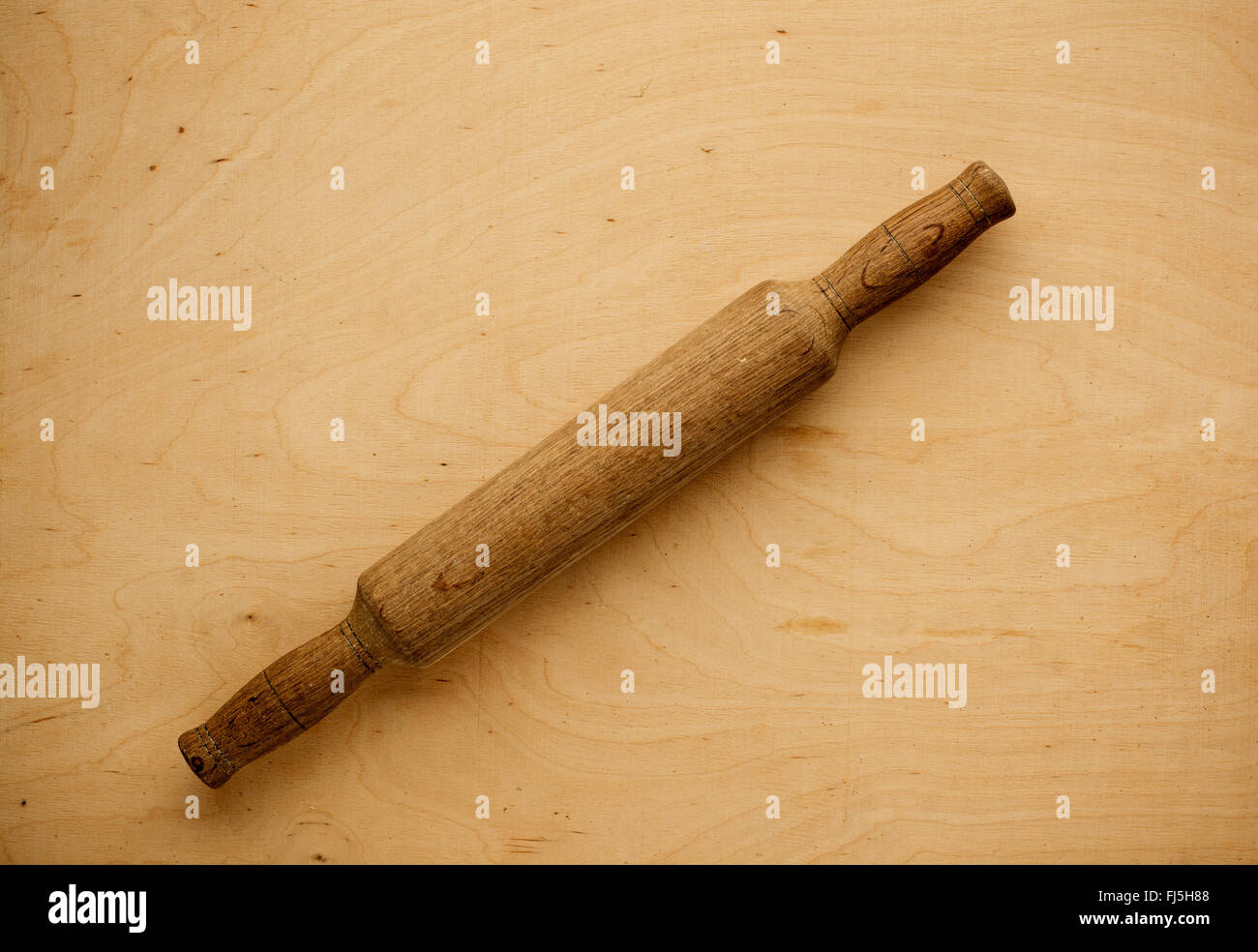 Wooden rolling pin over wood background, above view Stock Photo - Alamy