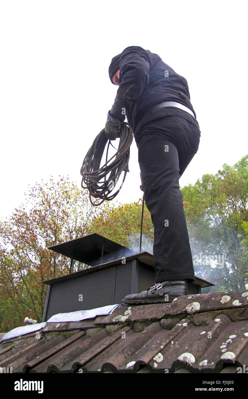 chimney sweeper at work on a roof, sweeping of a chimney, Germany Stock ...