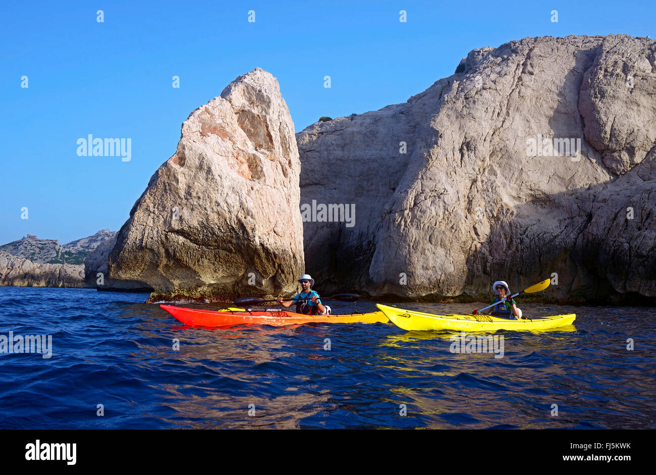 sea kayaks near the rocky coast, France, Provence, Calanques National ...