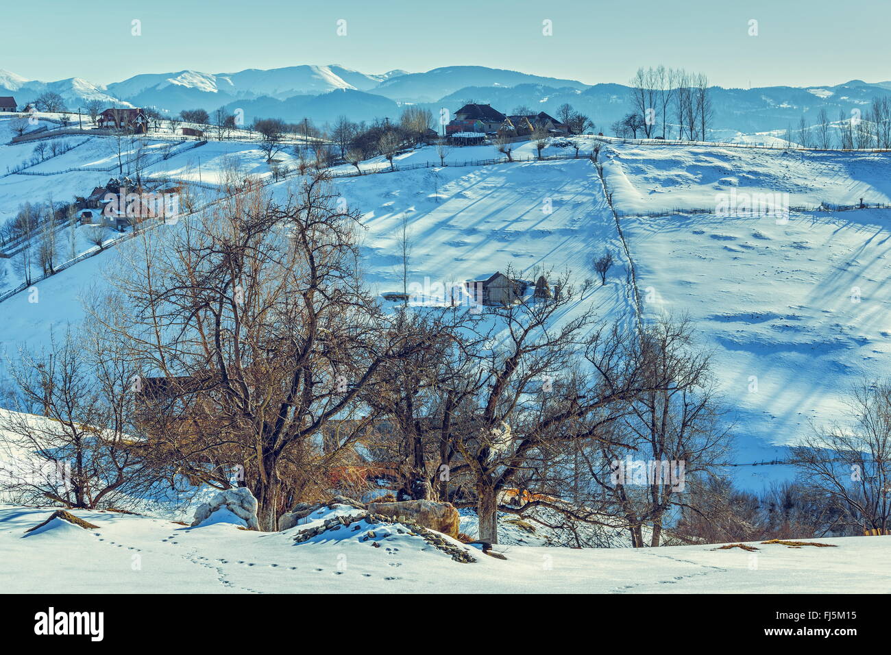 Sunny winter rural landscape uphill in old traditional Magura village ...