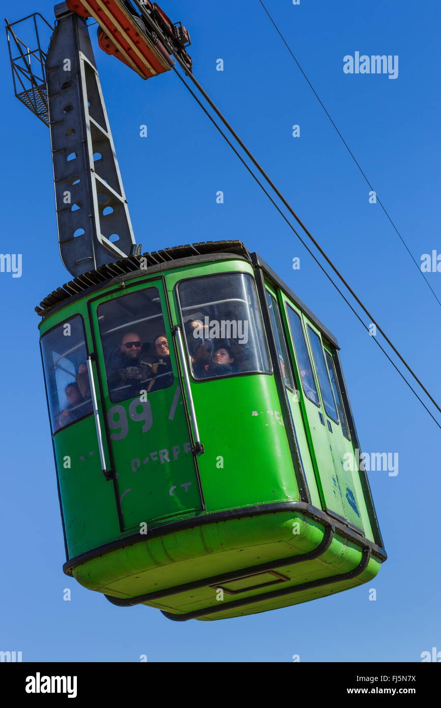 BUCEGI, ROMANIA - OCTOBER 10, 2015: Overhead green cable car cabin ...