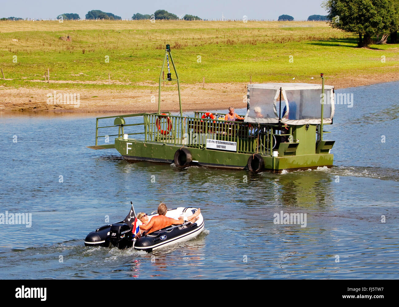 rubber boat and bicycle ferry on Altrhein, Germany, North Rhine ...