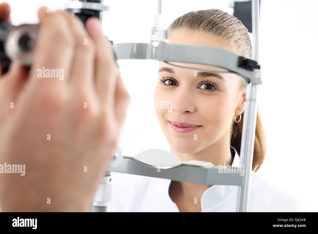 Young attractive doctor ophthalmologist at an ophthalmologist. A ...