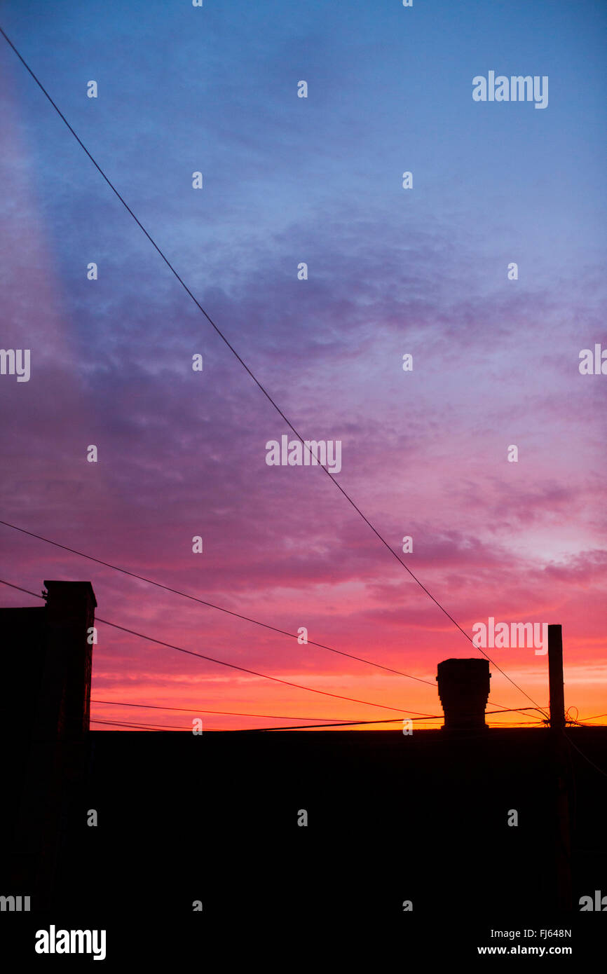 Colourful sunset seen over rooftops in the city centre of Bristol Stock ...