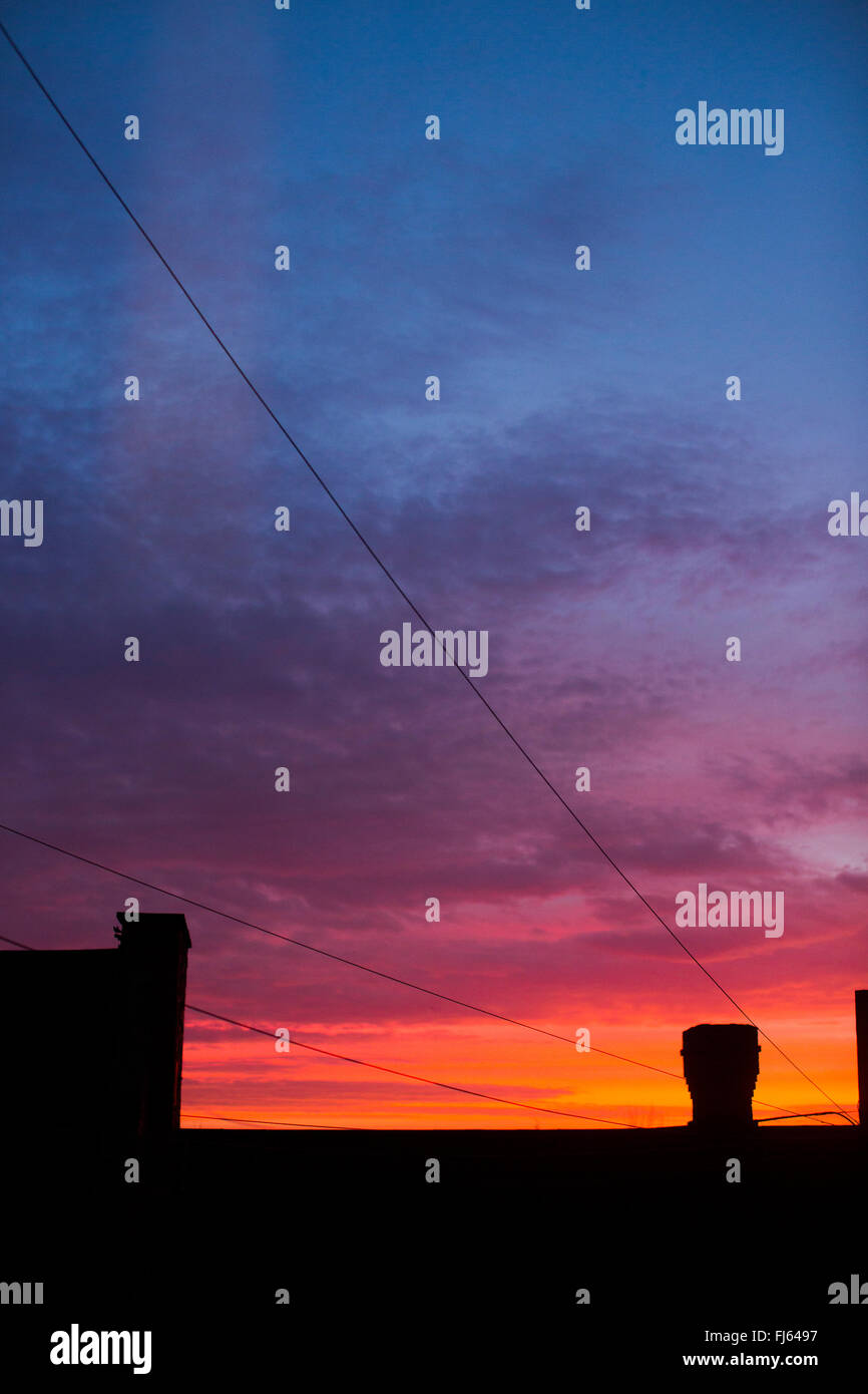 Colourful sunset seen over rooftops in the city centre of Bristol Stock ...