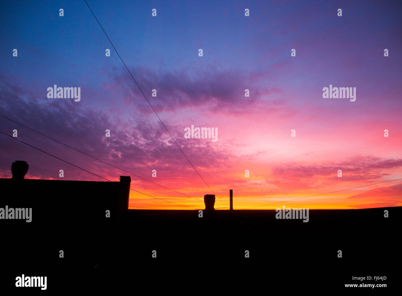 Colourful sunset seen over rooftops in the city centre of Bristol Stock ...