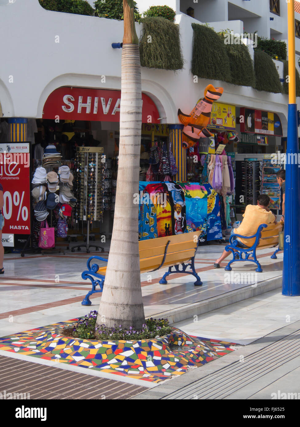 Colourful decorated pavement and tourist shops in Playa las Americas ...
