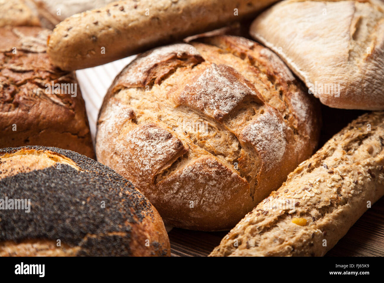 Bread assortment on wooden surface Stock Photo - Alamy