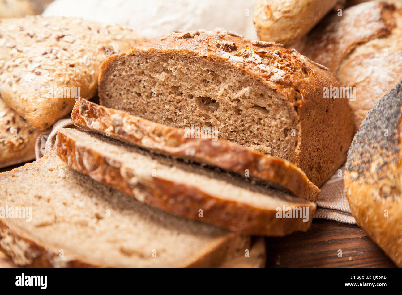 Bread assortment on wooden surface Stock Photo - Alamy