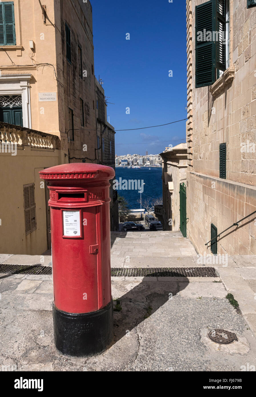 British-style red post box at the top of a steep steps in Valletta ...