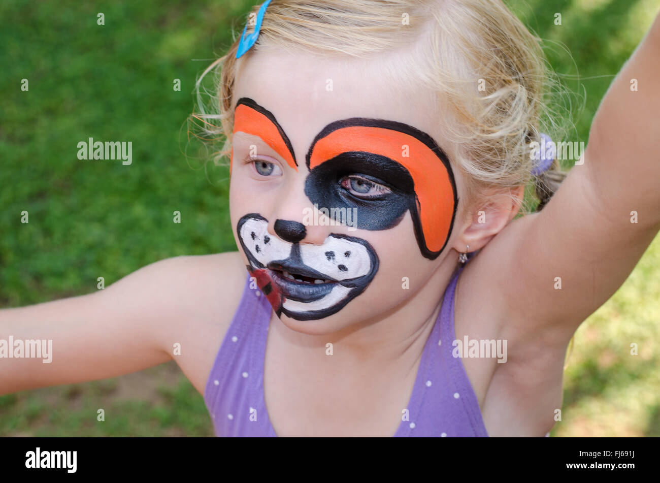 beautiful blond girl with face painting of dog Stock Photo - Alamy