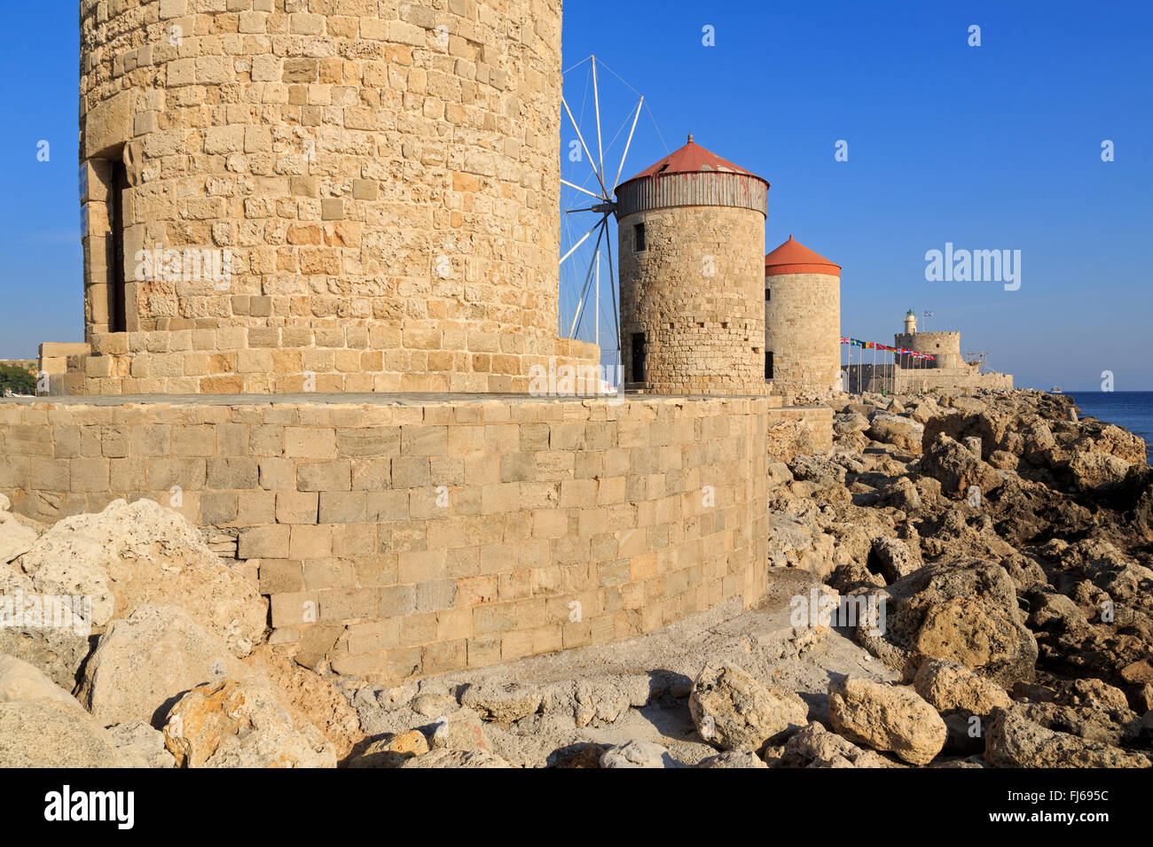 Windmills in Mandraki Harbor, Port of Rhodes, Greece, Europe Stock ...
