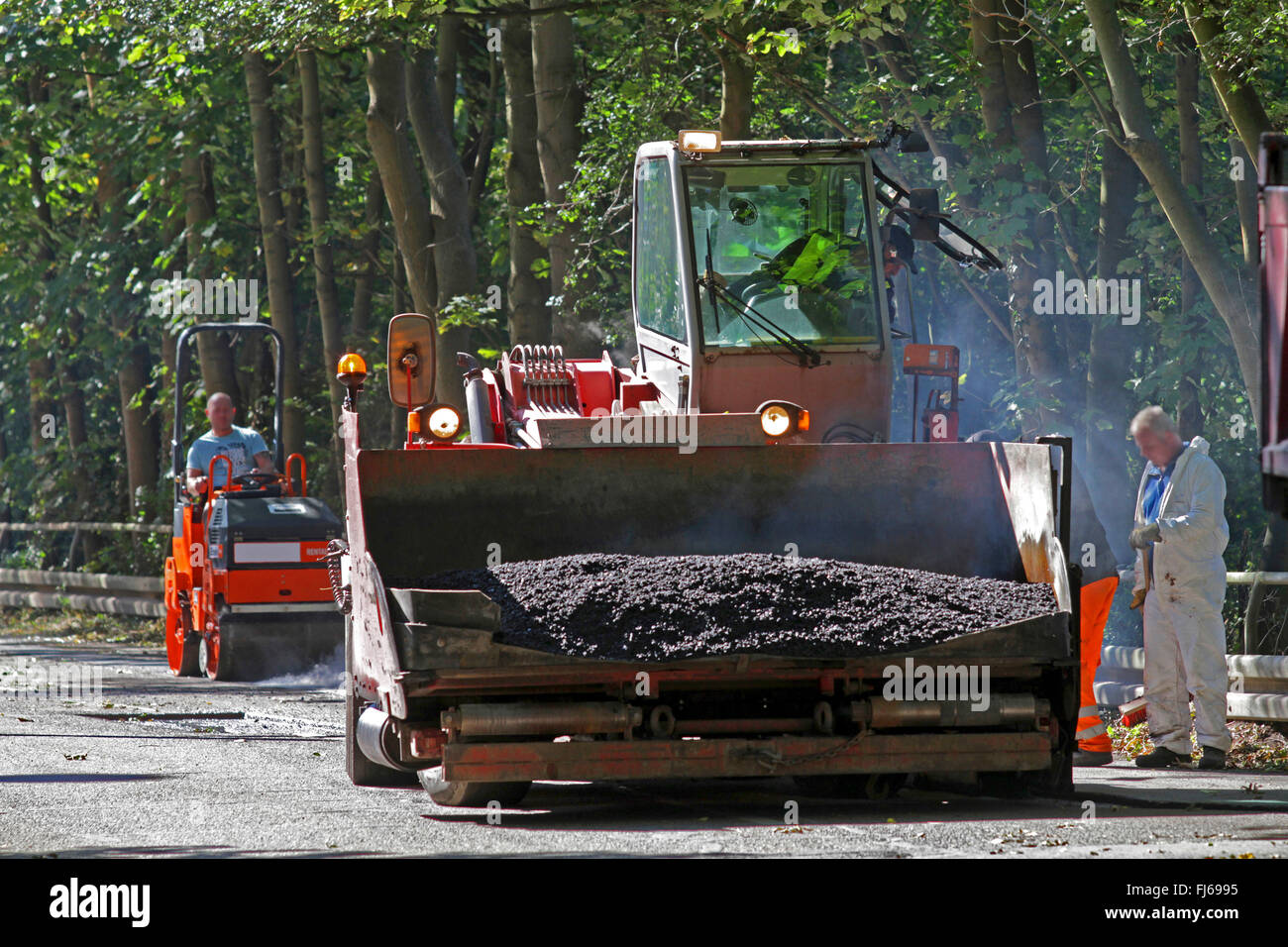 roadworks, tarmacking the road, Germany Stock Photo - Alamy