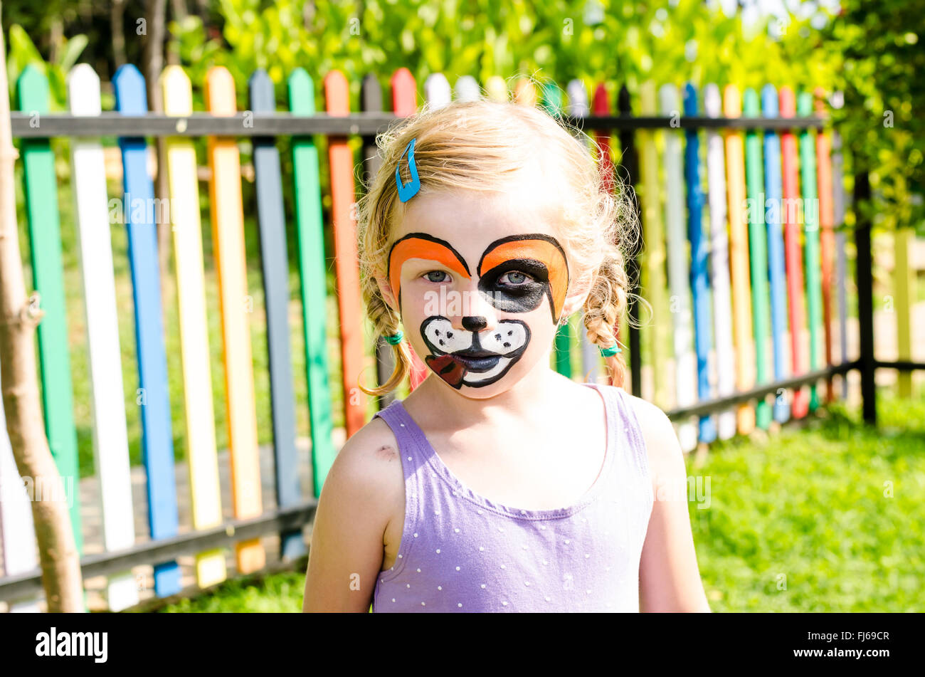 beautiful blond girl with face painting of dog Stock Photo - Alamy