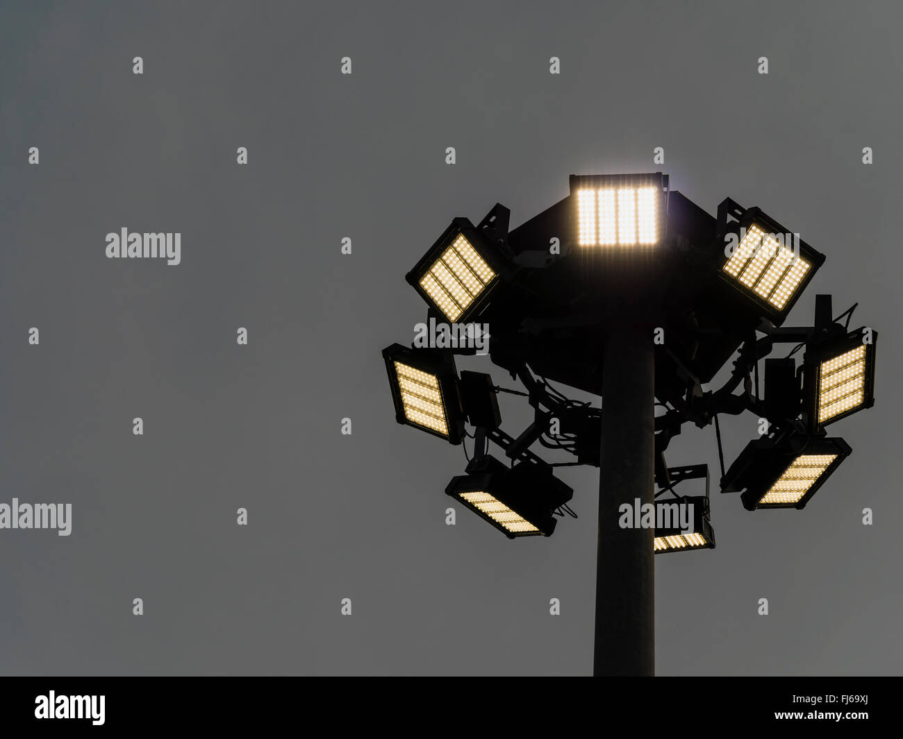 street tower light illuminating the evening sky backdrop Stock Photo ...