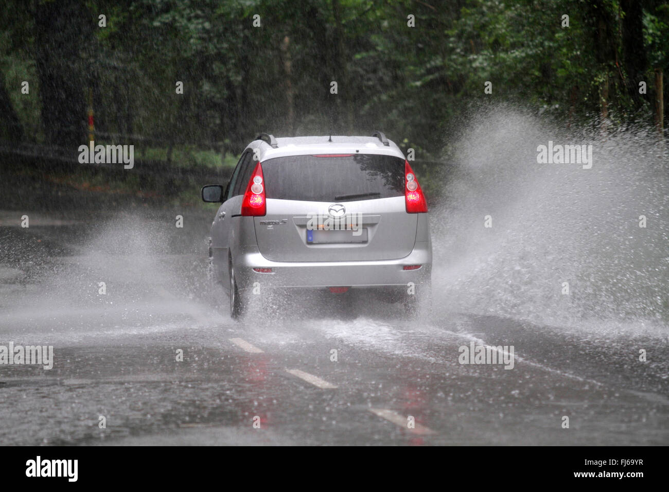 Cars driving on flooded road hi-res stock photography and images - Alamy