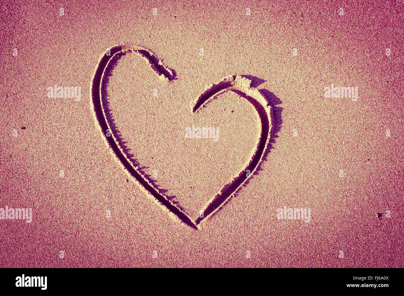 heart image at sand background Stock Photo - Alamy
