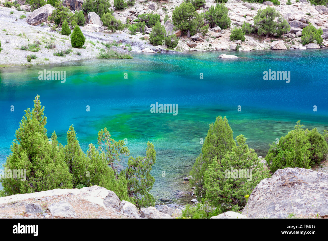 Blue lake and forest terrain in Asia Stock Photo - Alamy