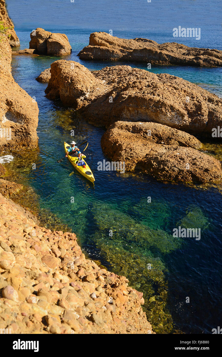 Sea kayaking at rocky coast, France, Provence, Calanques National Park ...