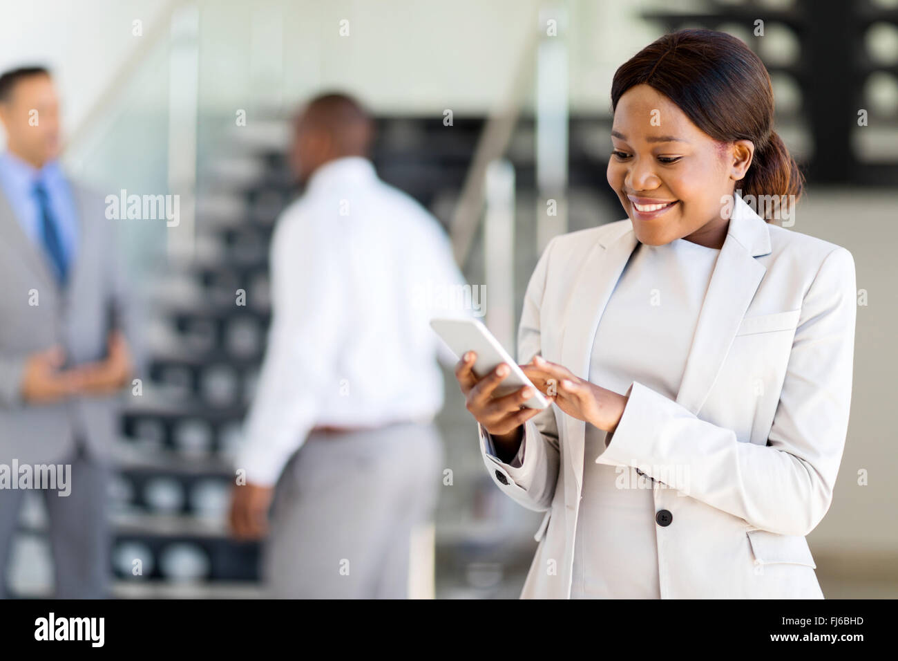 beautiful young African American career woman using cell phone Stock ...