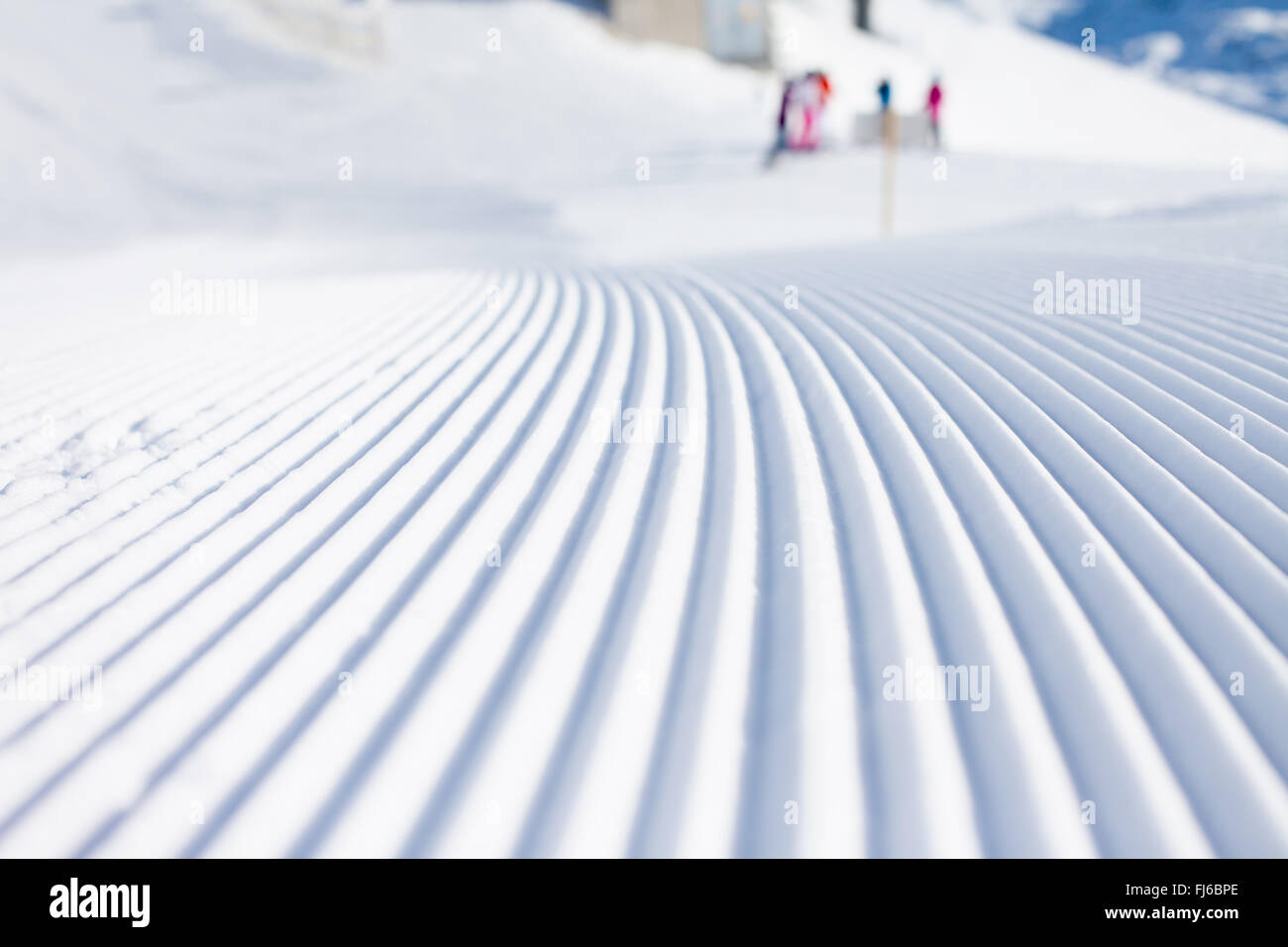 Snow lines made from a snow machine on a ski slope Stock Photo - Alamy