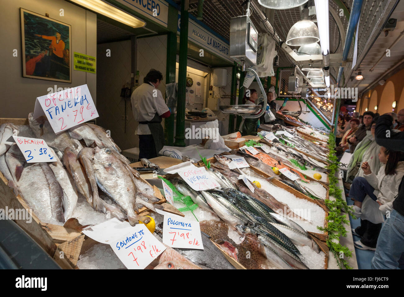 Clients buying fish in a Fishmonger in the Pamplona market, Navarra ...