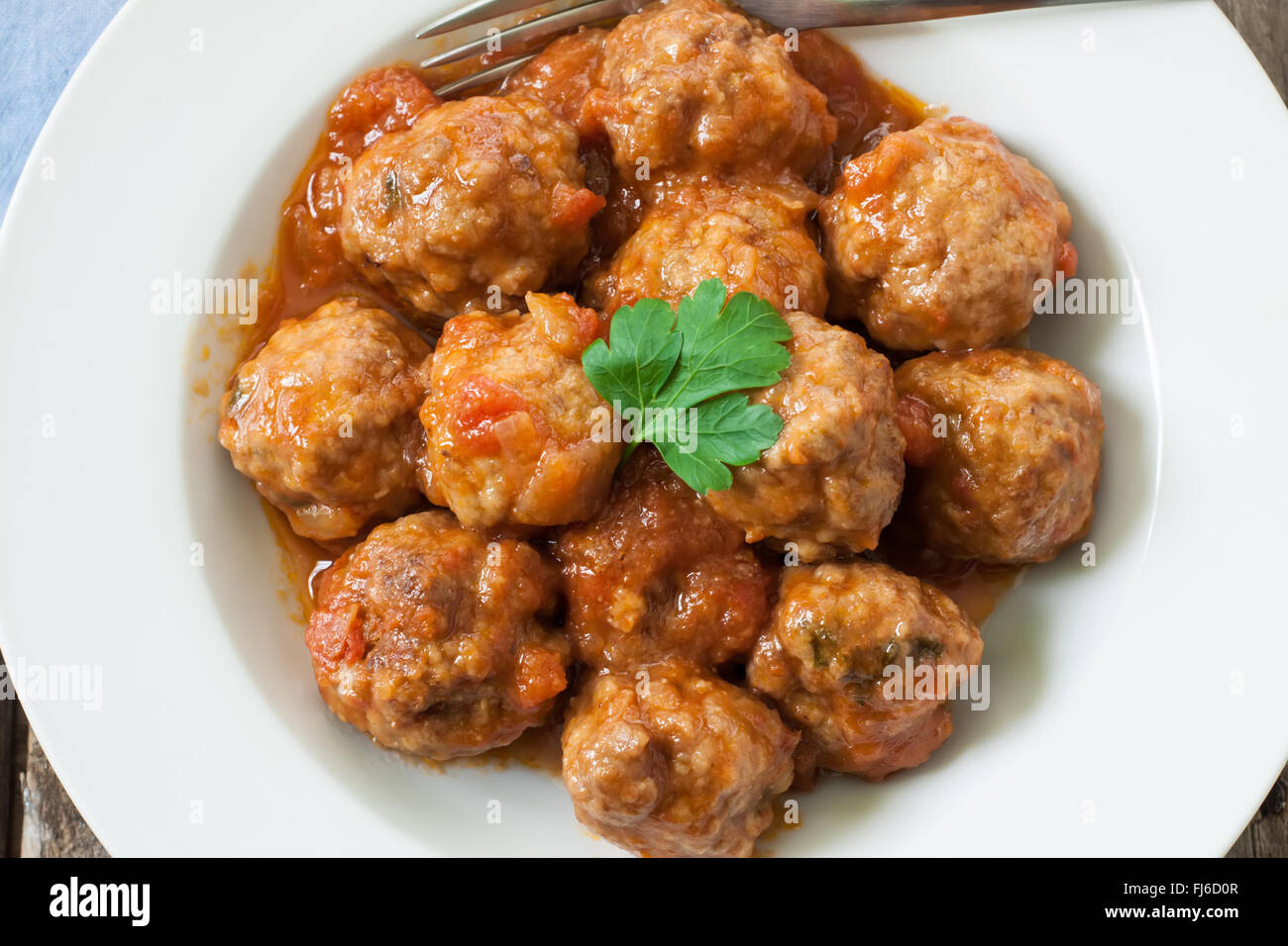 beef meatballs on tomato sauce with rice for side Stock Photo - Alamy