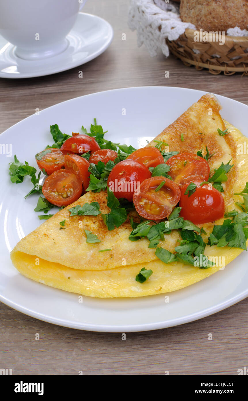 Omelette tomatoes and herbs, coffee with fresh pastries Stock Photo - Alamy