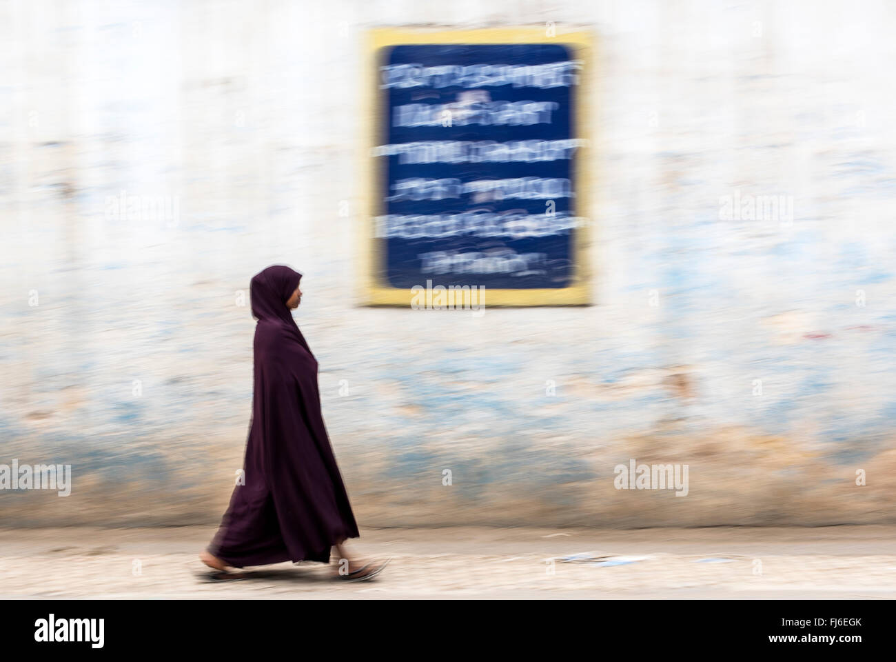 Woman wearing traditional dress walking in Harar, Ethiopia, Africa ...
