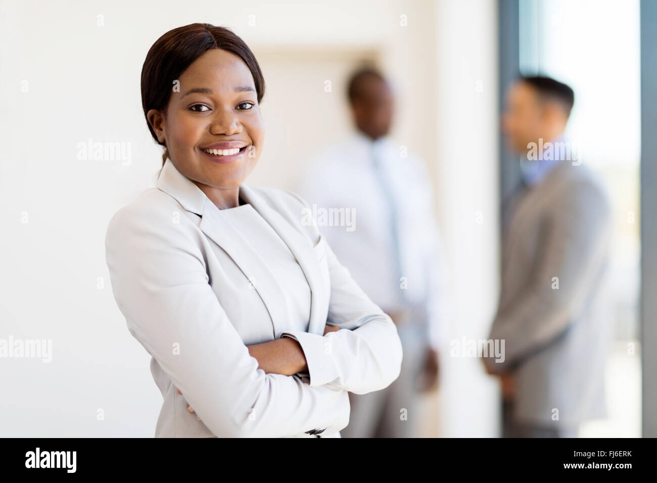 pretty African female corporate worker in office Stock Photo - Alamy