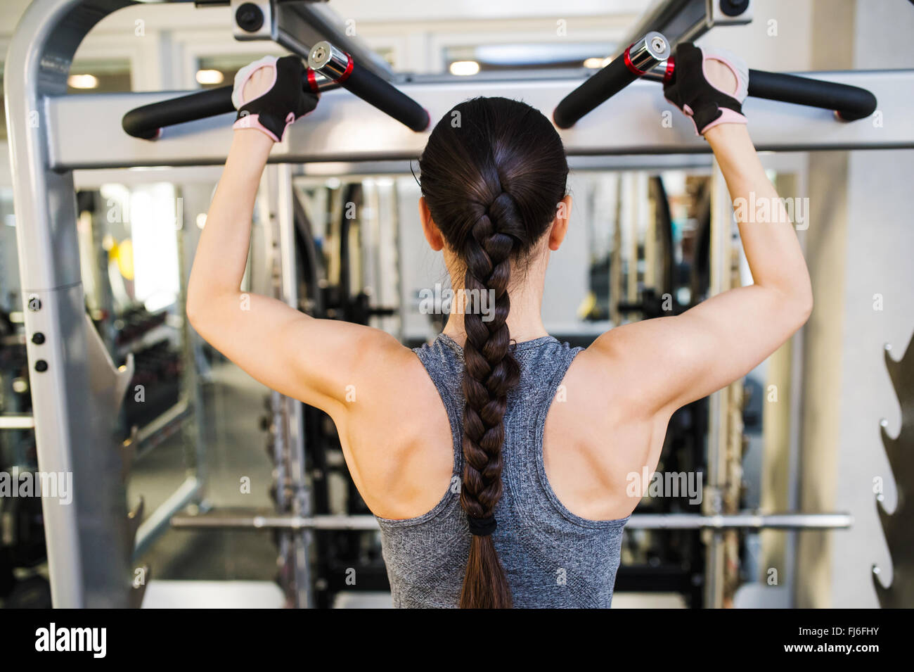 Woman flexing arms hi-res stock photography and images - Alamy