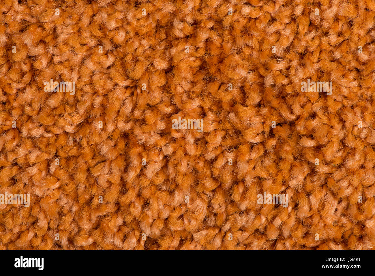 Closeup detail of orange carpet texture background Stock Photo - Alamy