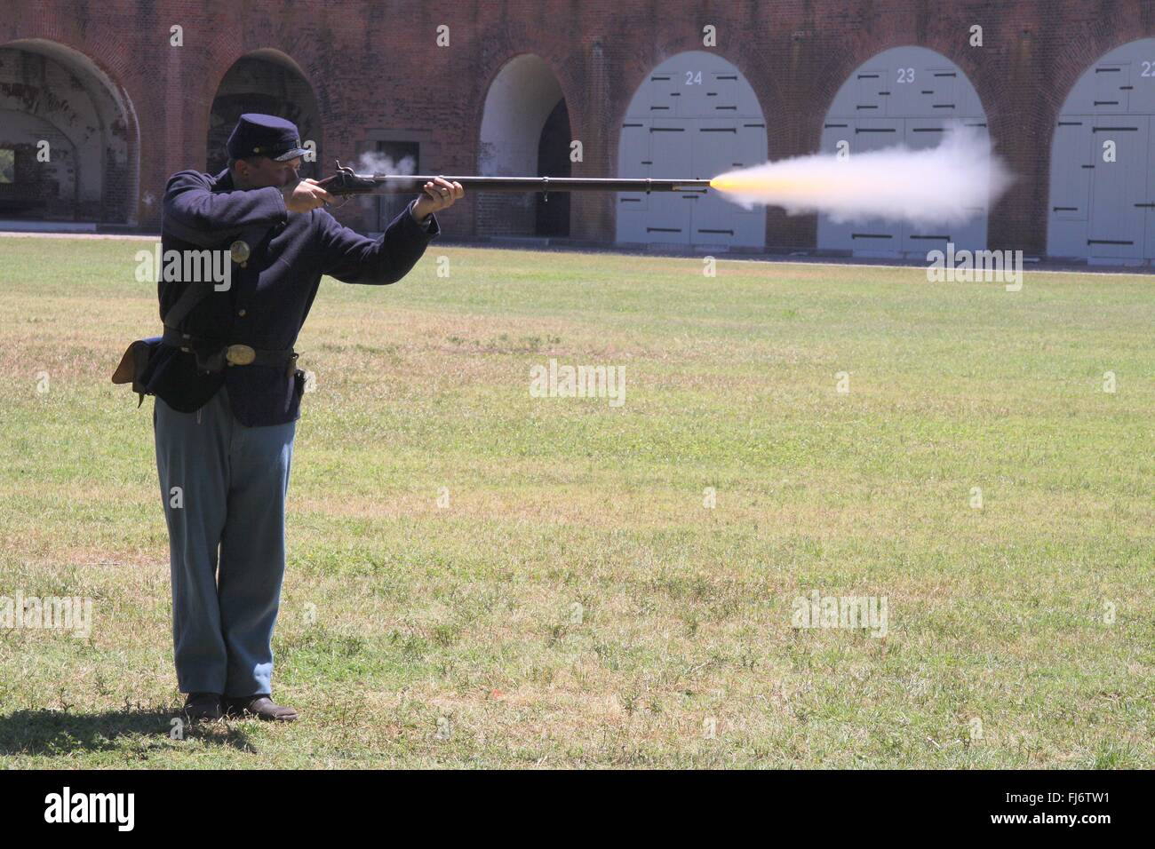 US Civil War re-enactor firing a musket at Fort Pulaski, Georgia Stock ...