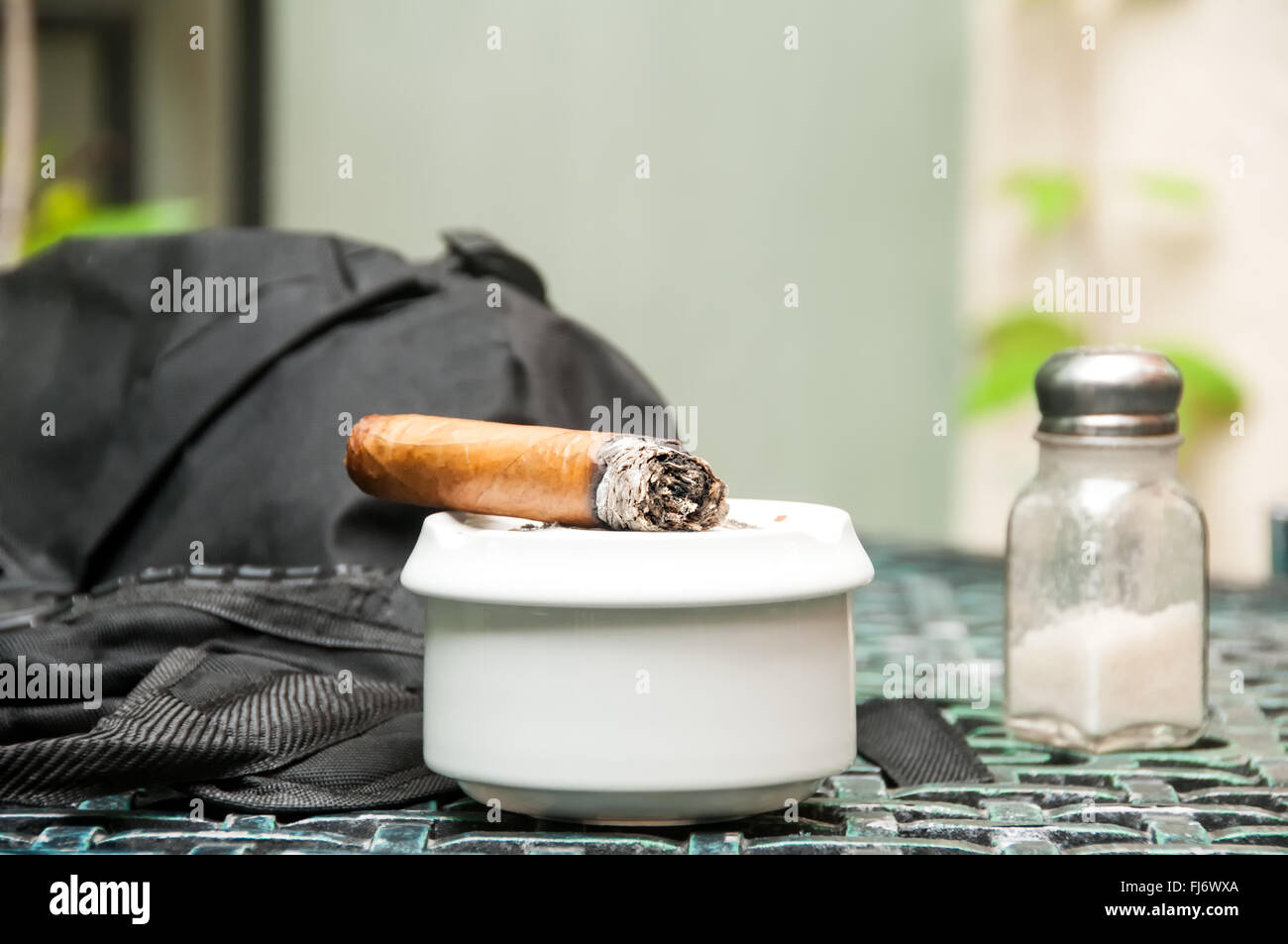 Cuban cigar lit on the table - Havana, Cuba Stock Photo - Alamy