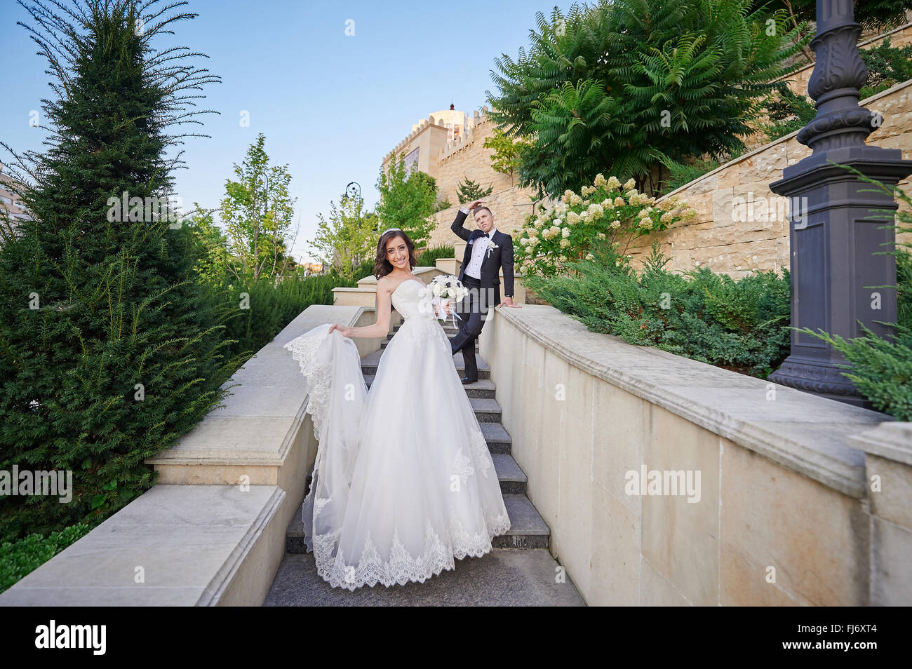 Holding hands walking up stairs hi-res stock photography and images - Alamy