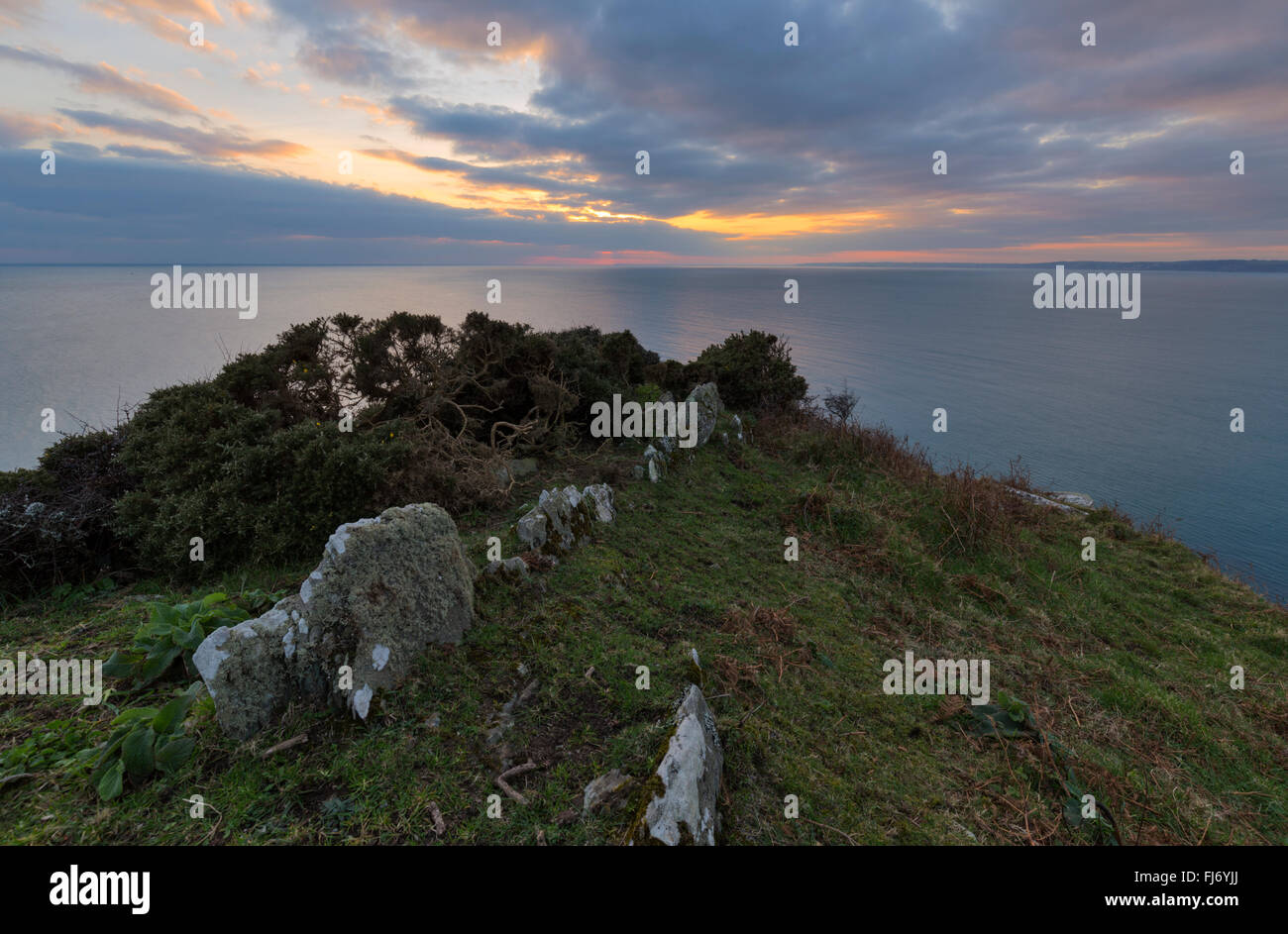 The sun setting over Rame Head in East Cornwall Stock Photo - Alamy