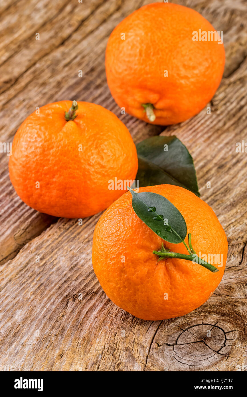 Tangerines Fruits on Old Wood Stock Photo - Alamy
