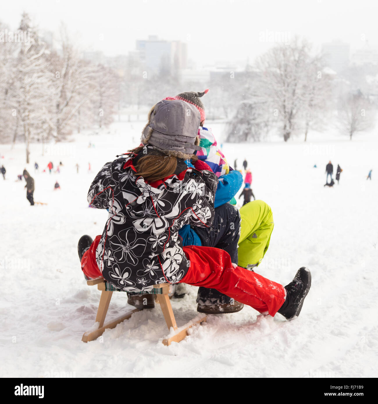 Winter fun, snow, children sledding at winter time Stock Photo - Alamy
