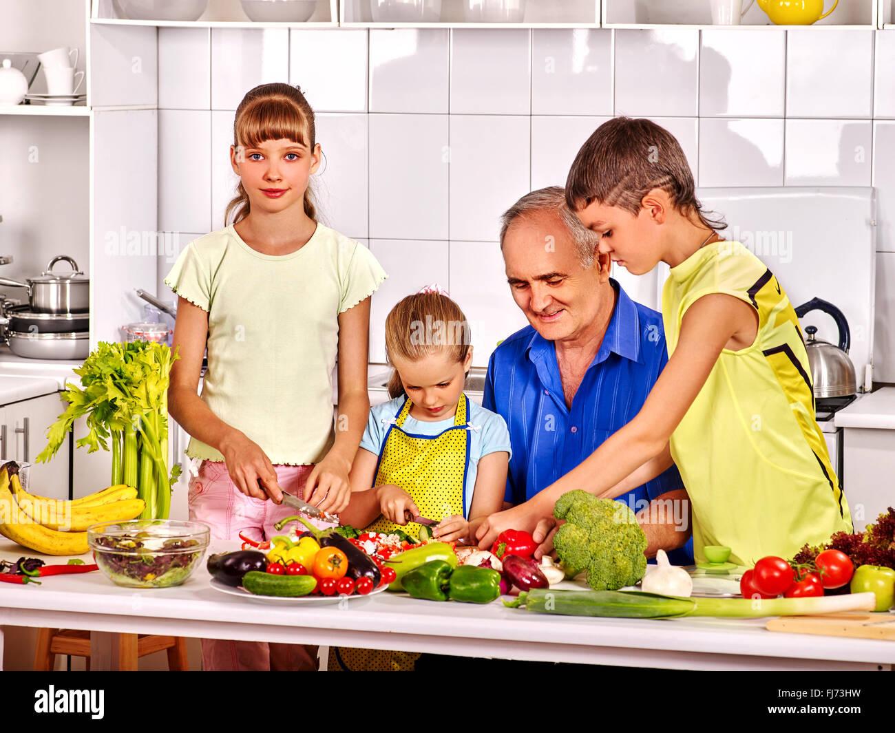 Family cooking at kitchen Stock Photo - Alamy