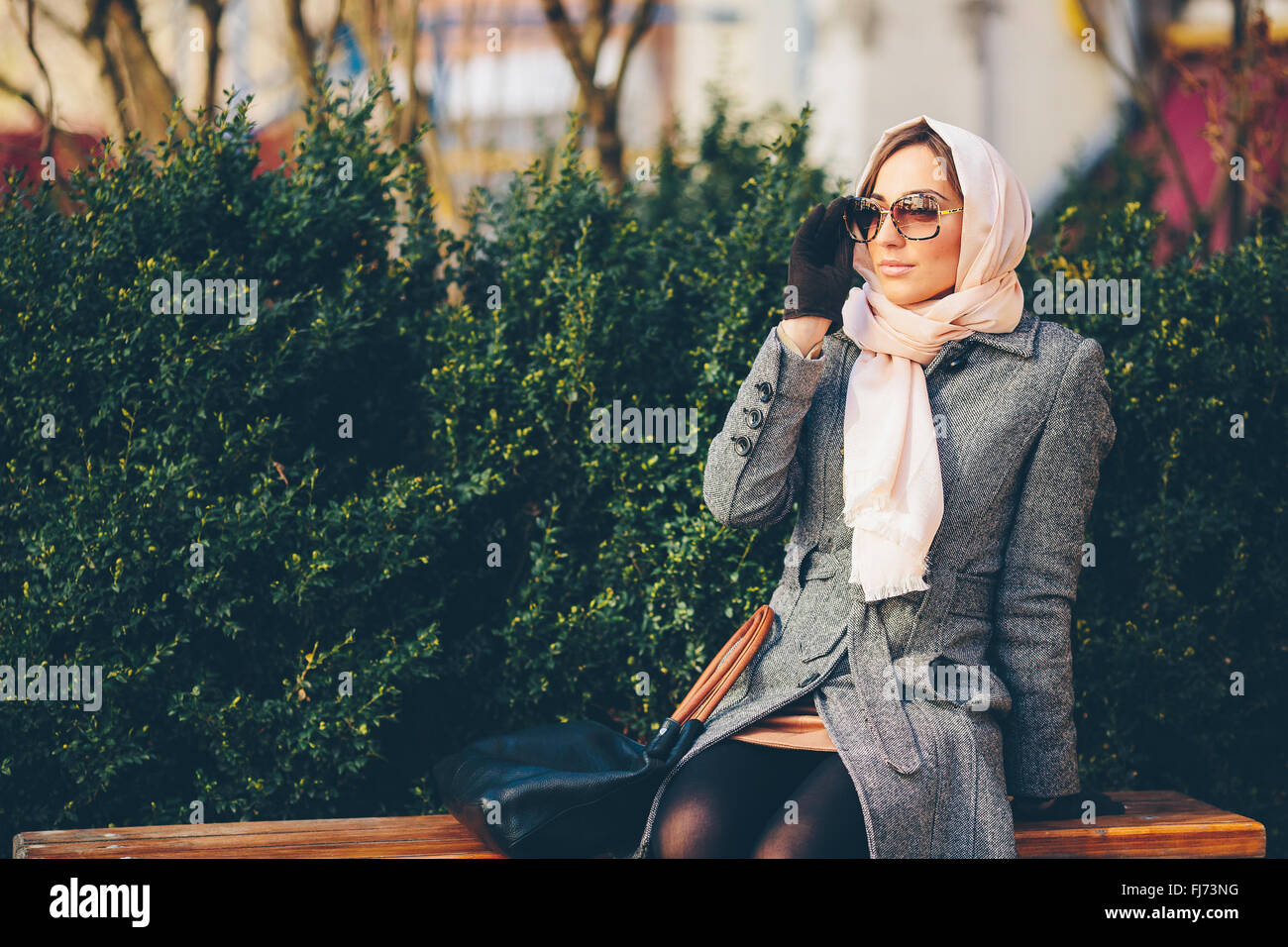 girl sitting on a bench in the park Stock Photo - Alamy