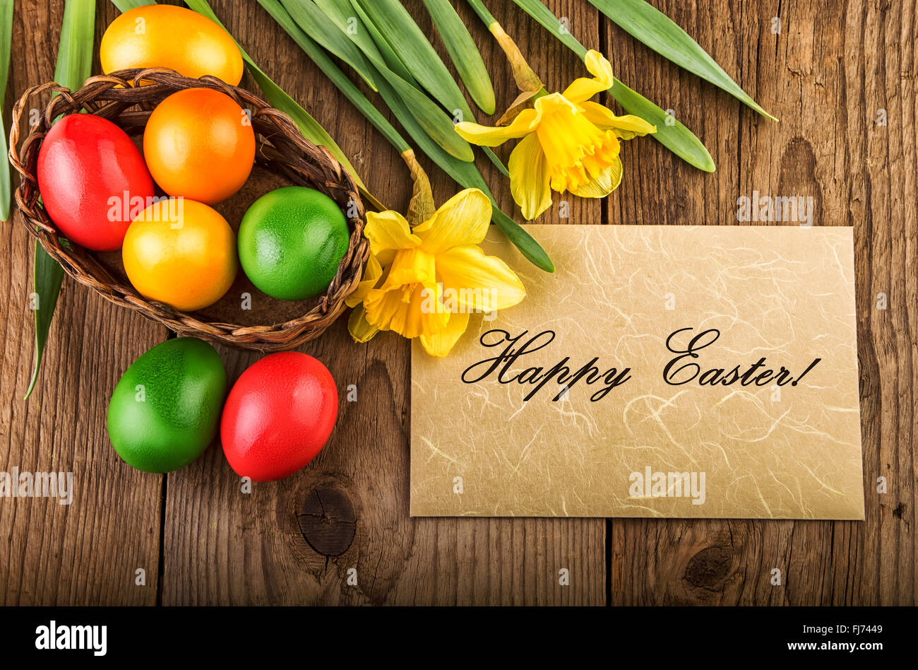 Easter background with spring flowers and paper sheet Text Happy Easter ...