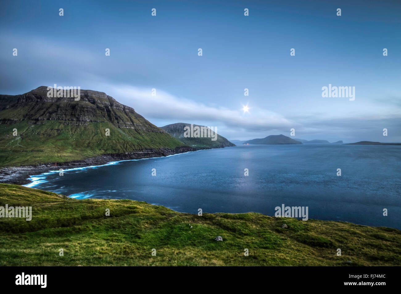 Full Moon, Mountains and Ocean at Twilight Hour. Faroe islands, Denmark ...
