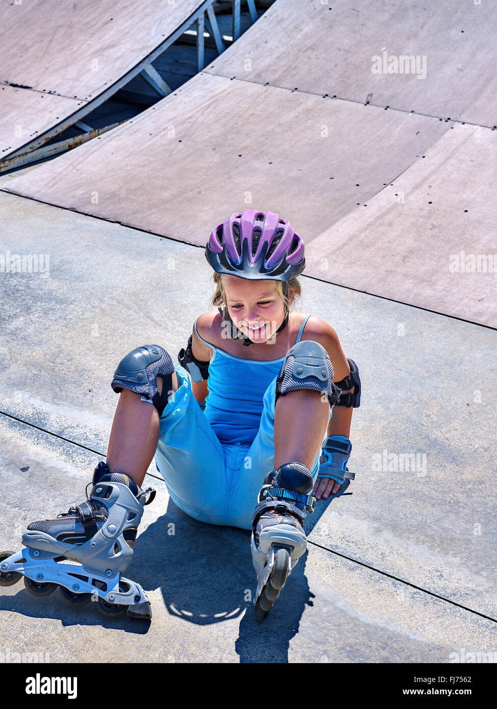 Girl riding on roller skates Stock Photo - Alamy